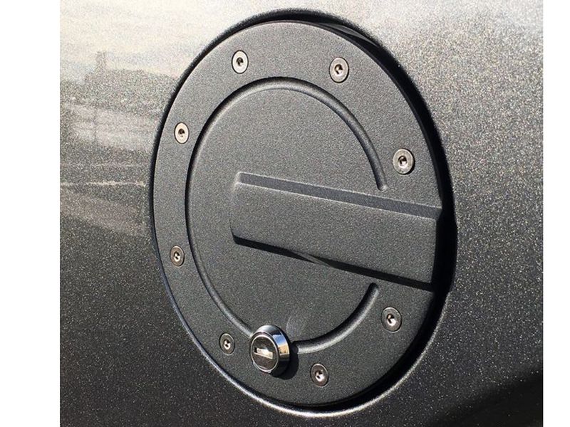 AMI Black Billet Aluminum Fuel Door 6152KL | RealTruck